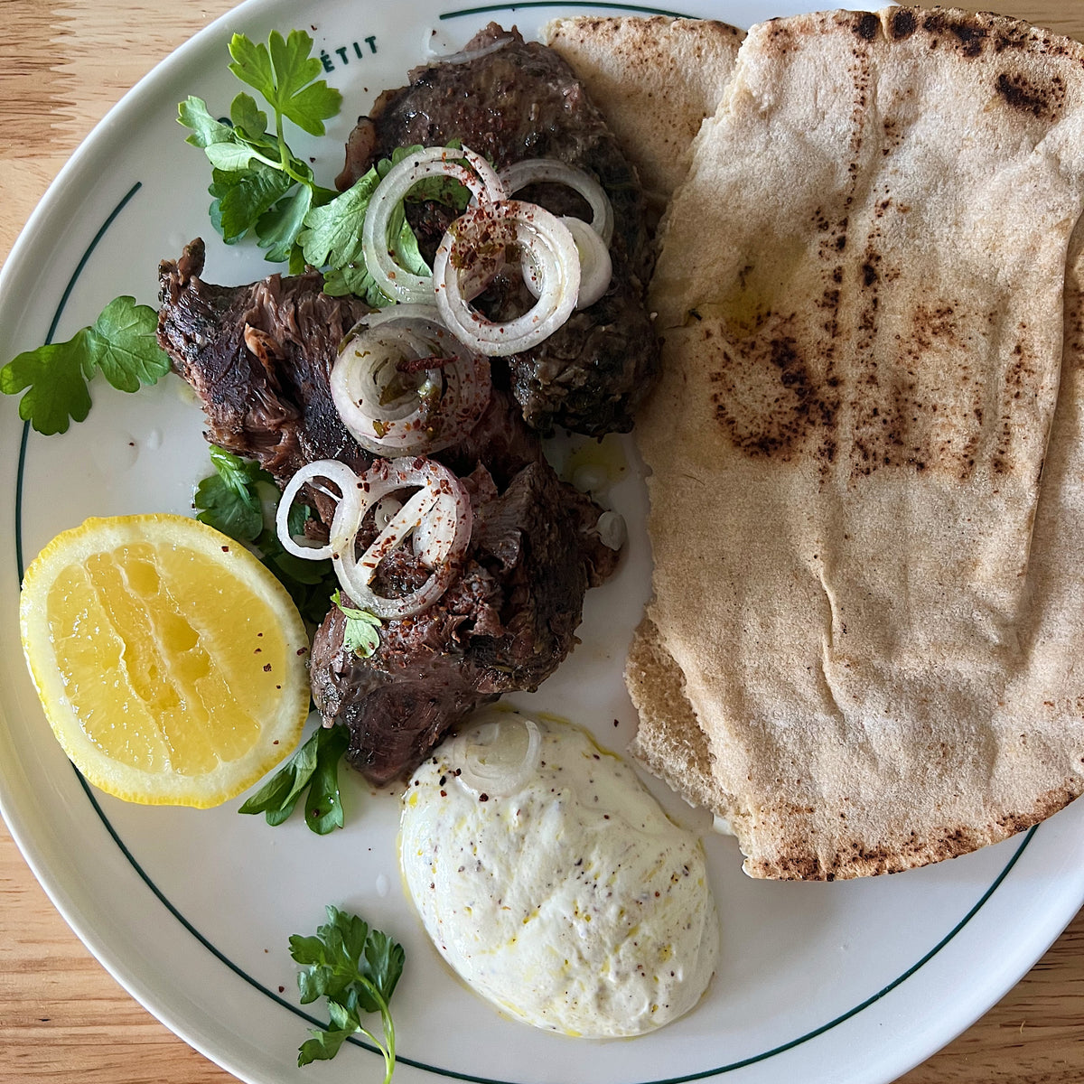 Slow cooked goat shoulder with sumac lemon yoghurt and pita ...